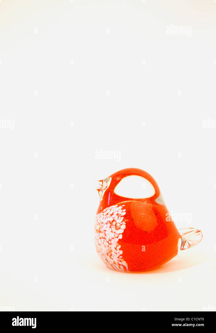 Red glass chicken isolated on a white background Stock Photo - Alamy