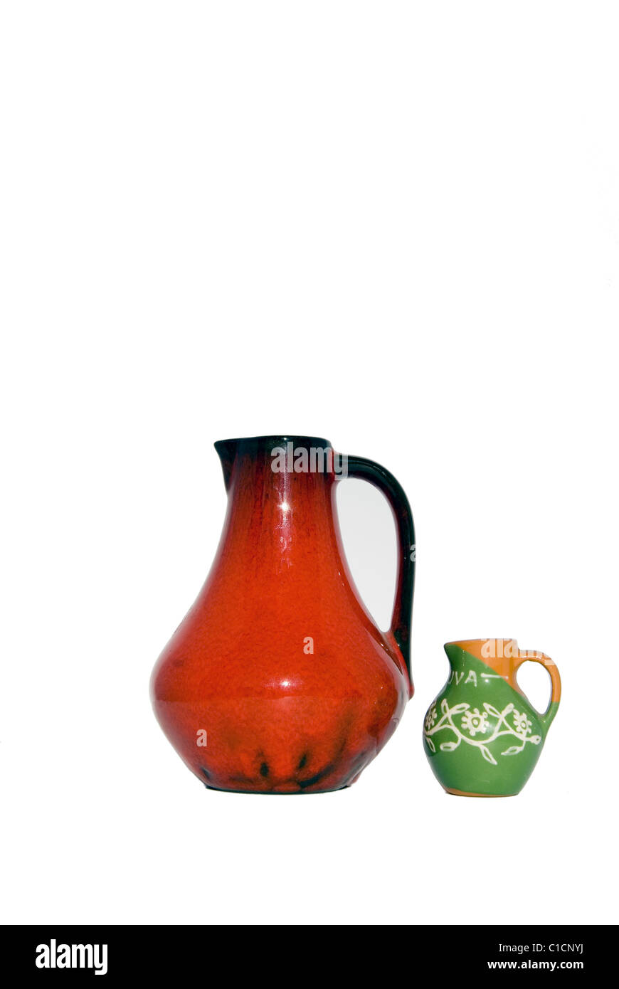 Two colored jugs isolated on a white background Stock Photo - Alamy