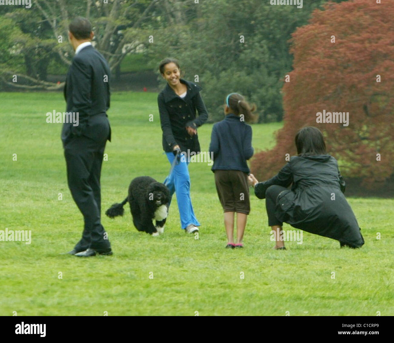 Malia Obama walks her new six-month old Portuguese water dog Bo ...