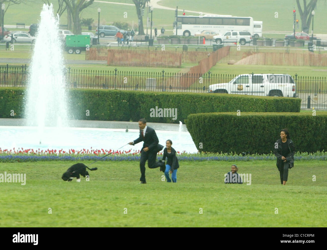 President Barack Obama runs with his family's new dog, a Portuguese ...