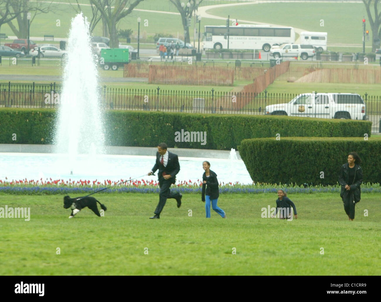 President Barack Obama runs with his family's new dog, a Portuguese ...
