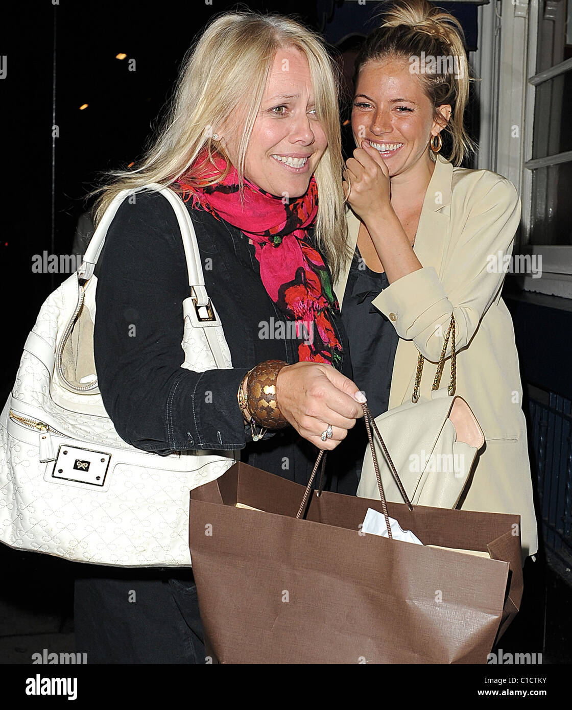 Sienna Miller and a female friend appear in high spirits as they leave ...