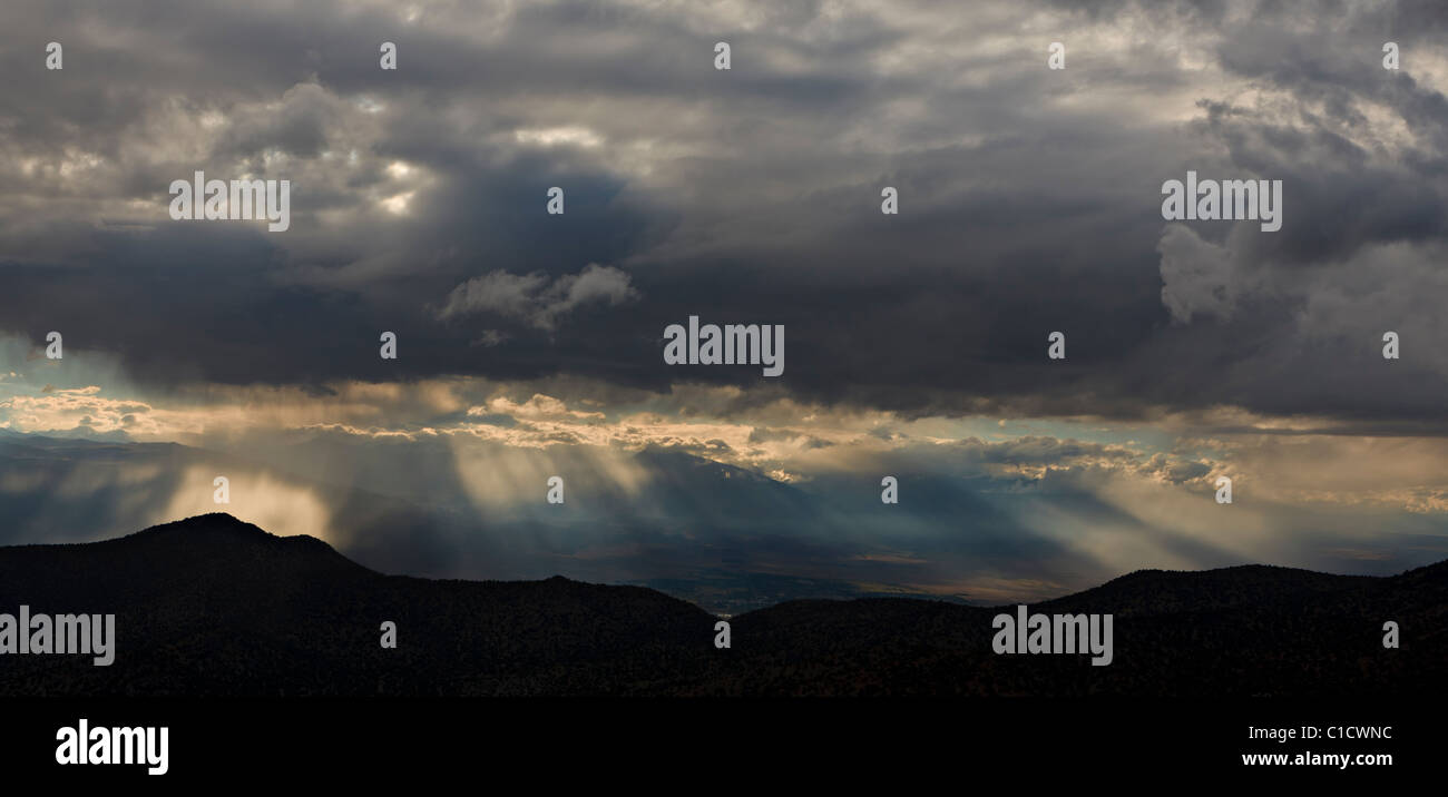 God beams (crepuscular rays) beam down over Owens Valley as seen from ...