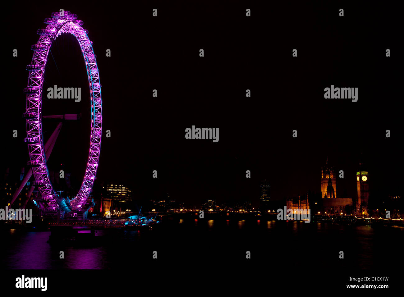 London Eye lit up in purple for the New Years Eve 2010 Celebrations in ...