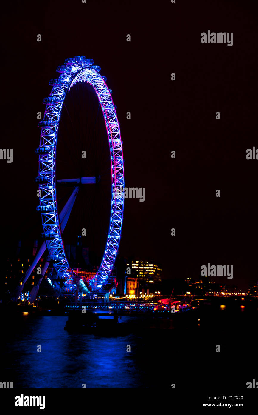 London Eye lit up in blue and purple for the New Years Eve 2010 ...