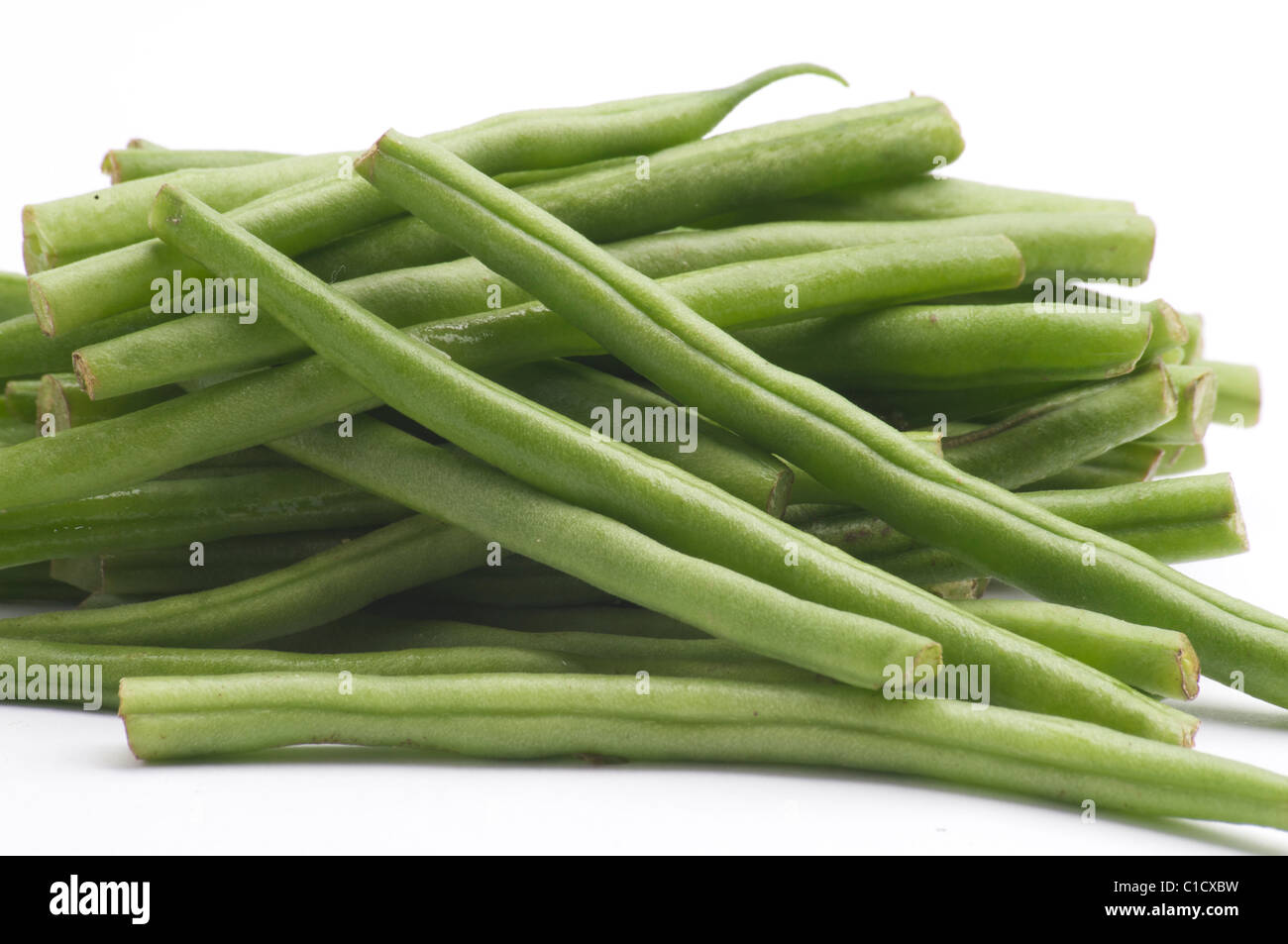 Fresh Long Green Beans, isolated on a white background table, lit with ...