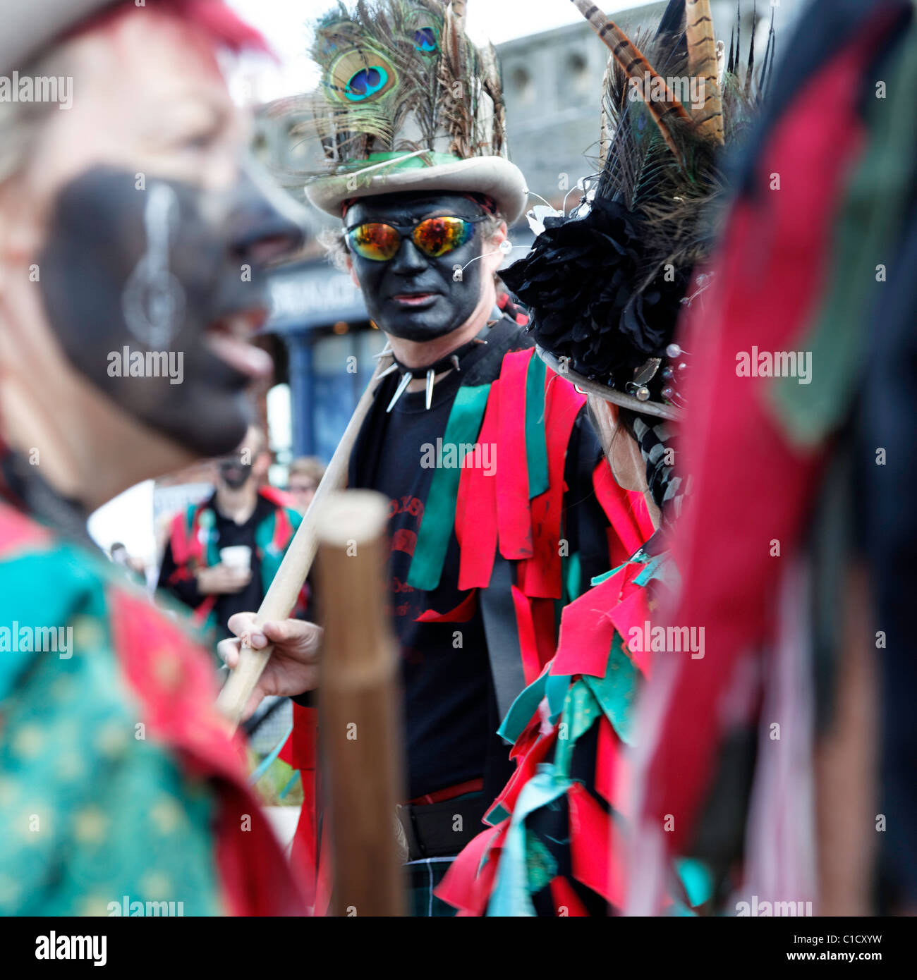 Traditional English Morris Dancing Men & Women In Rag Jackets & Blacked ...