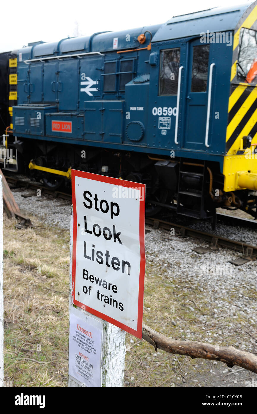stop look listen beware of trains sign england uk Stock Photo - Alamy