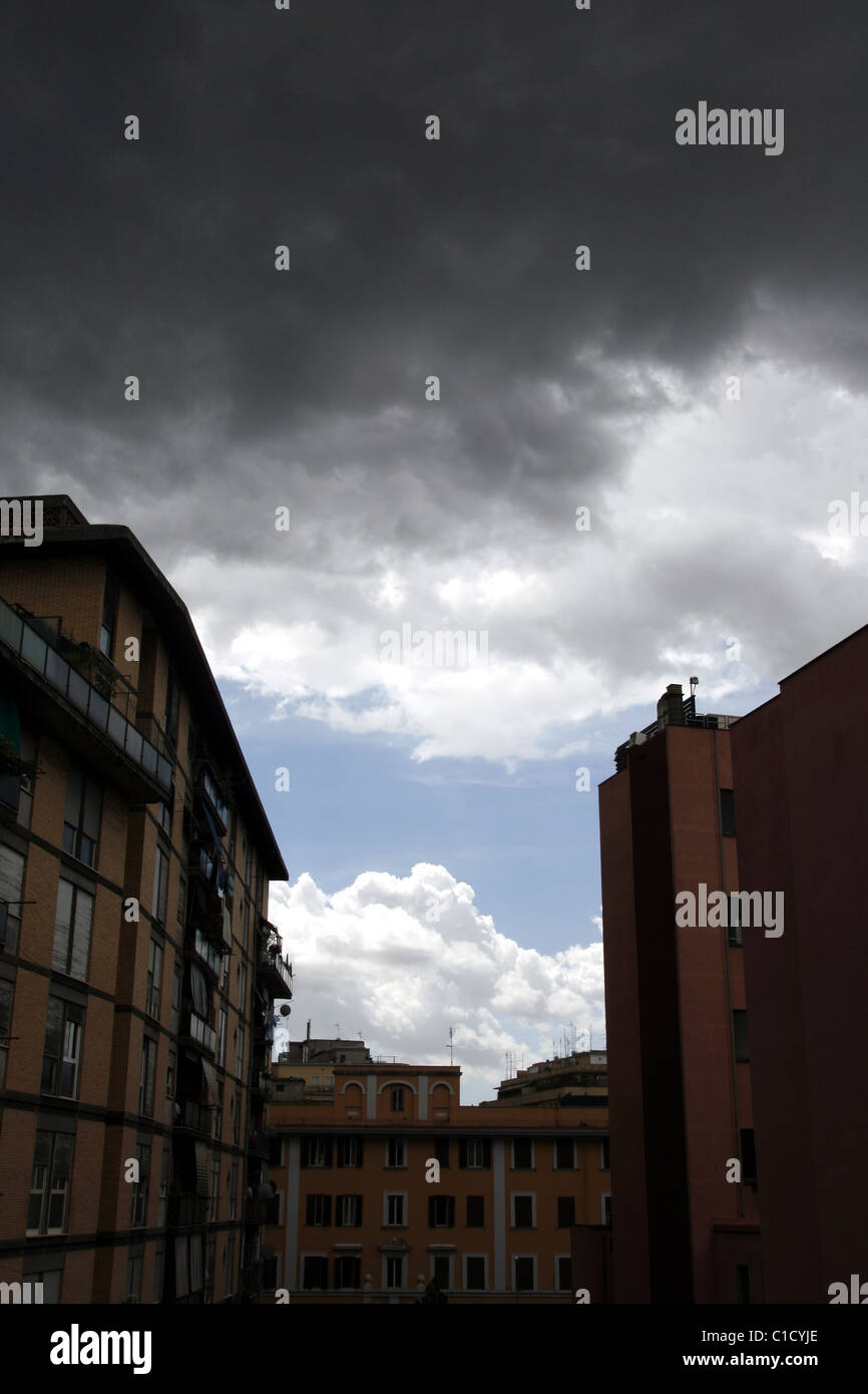 dark storm clouds over buildings in rome italy Stock Photo - Alamy