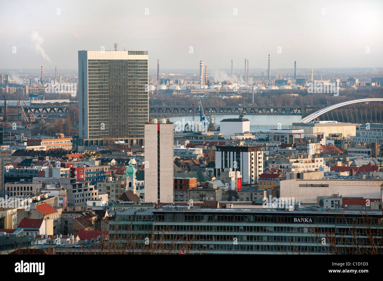 buildings in the center of Bratislava with refinery factory on the ...