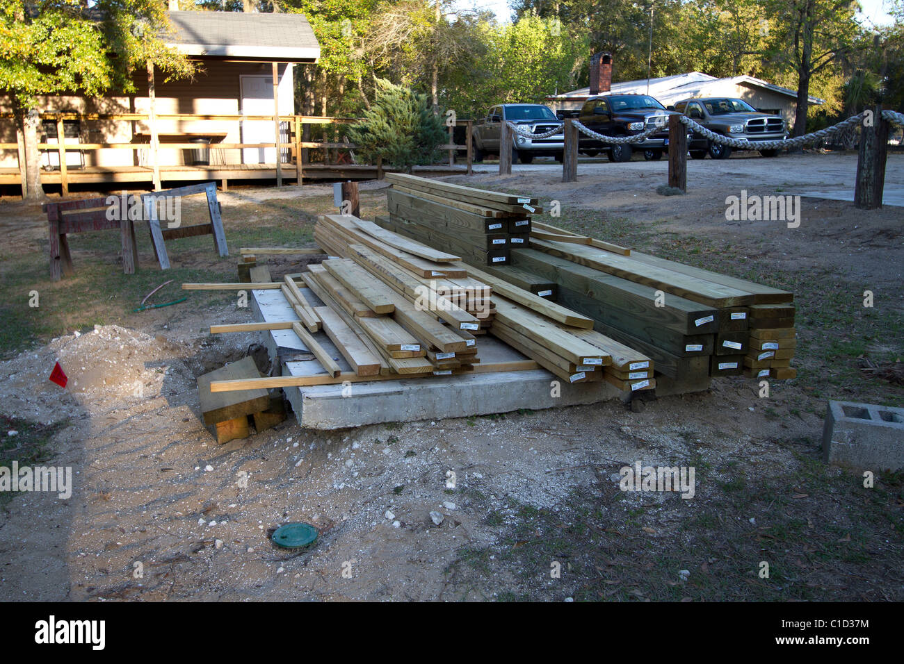 Stack of lumber waiting to be used at a small construction project ...