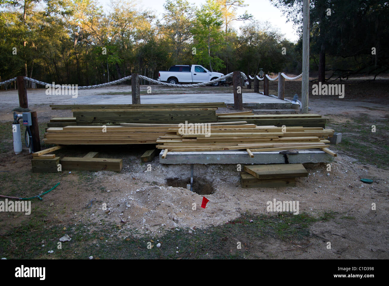 Stack of lumber waiting to be used at a small construction project ...