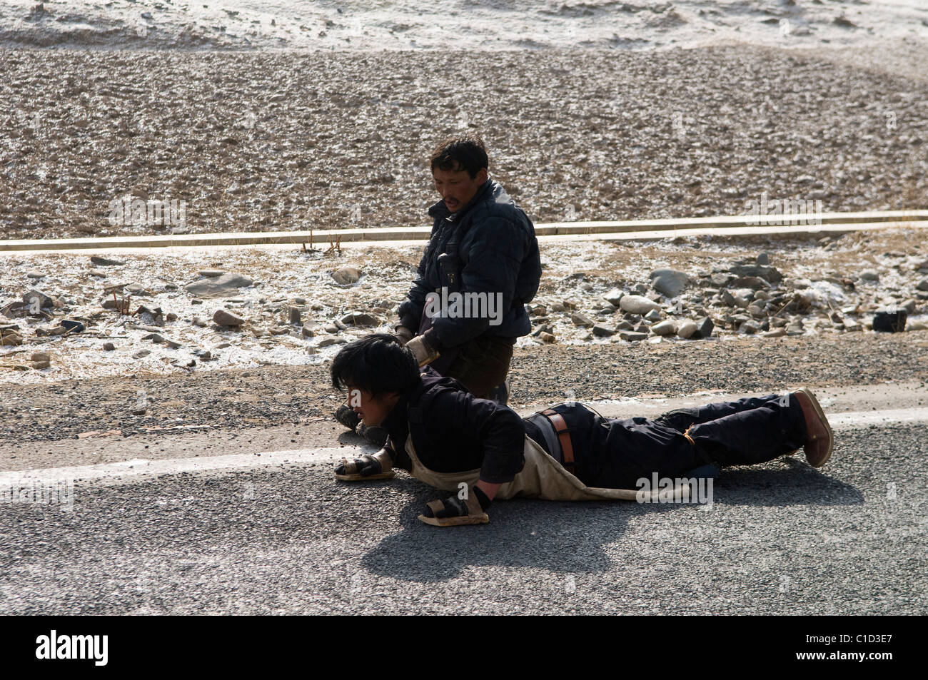 Pilgrims prostrating tibet hi-res stock photography and images - Alamy