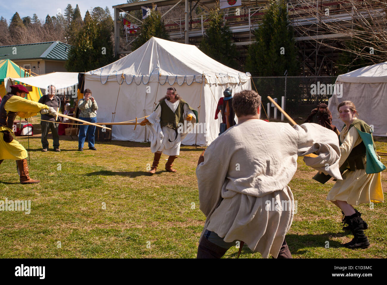 Burly men demonstrating their sword fighting technique at the Sonora ...