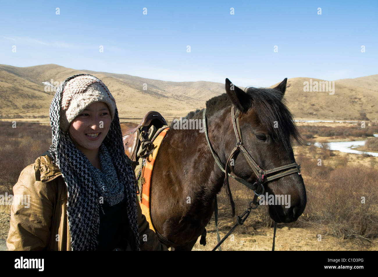 A colorful Tibetan woman in the regions of eastern Tibet ( Sichuan ...
