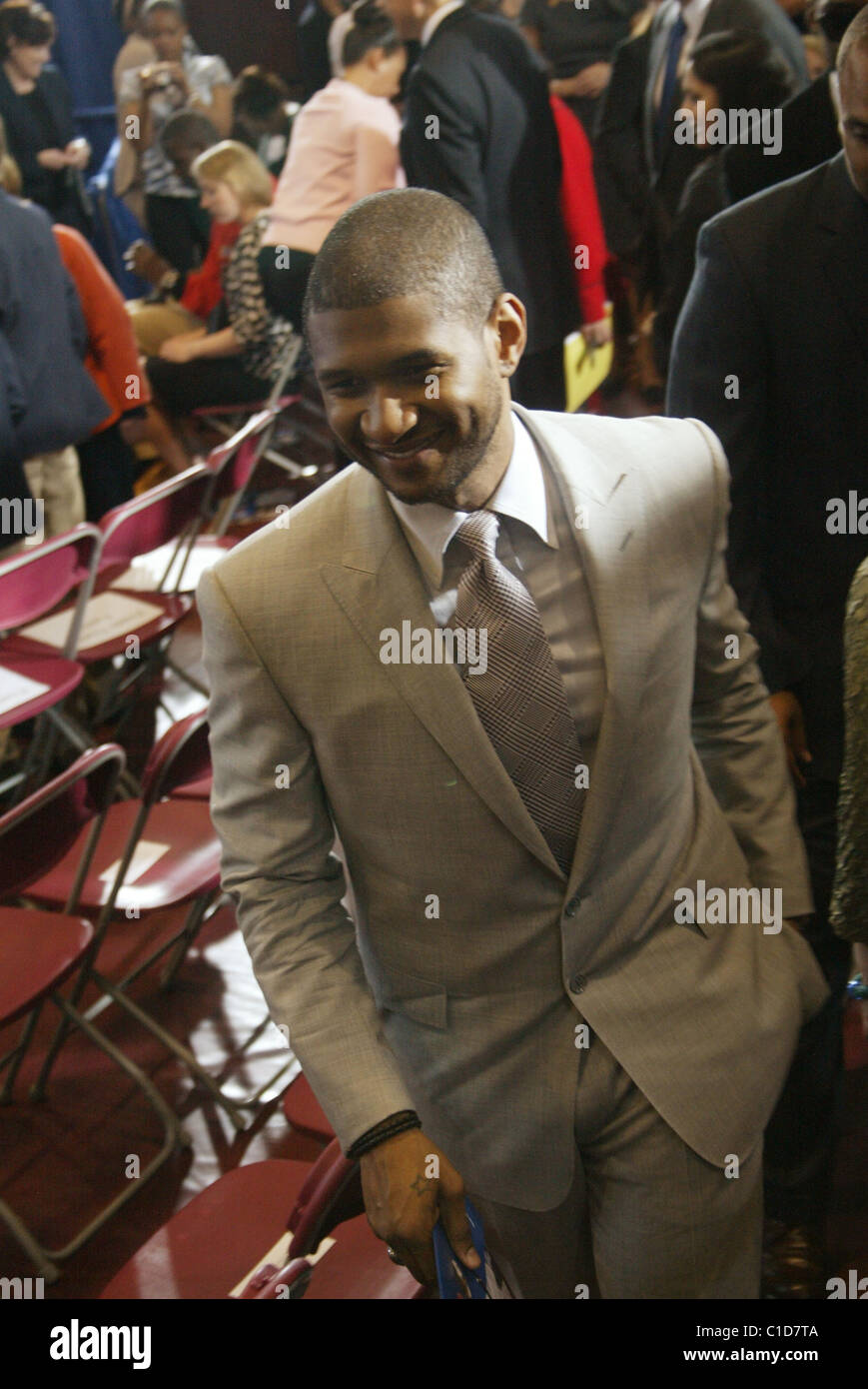 Singer Usher attends the signing of the Edward M. Kennedy Serve America ...