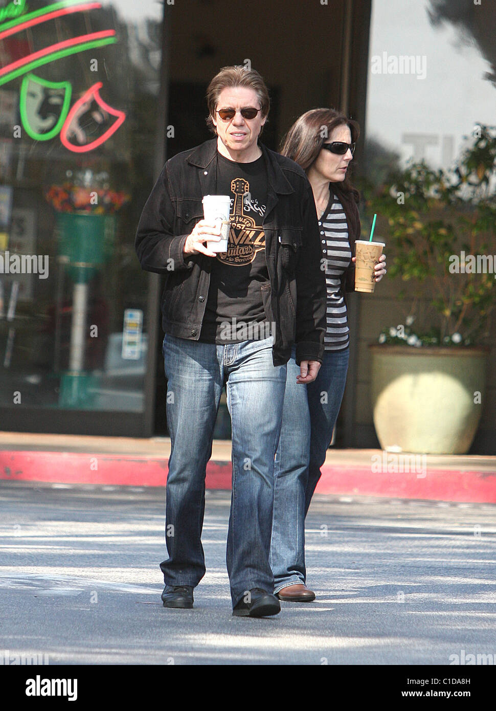 Rock 'n roller George Thorogood, 56, leaves a coffee shop holding hands ...