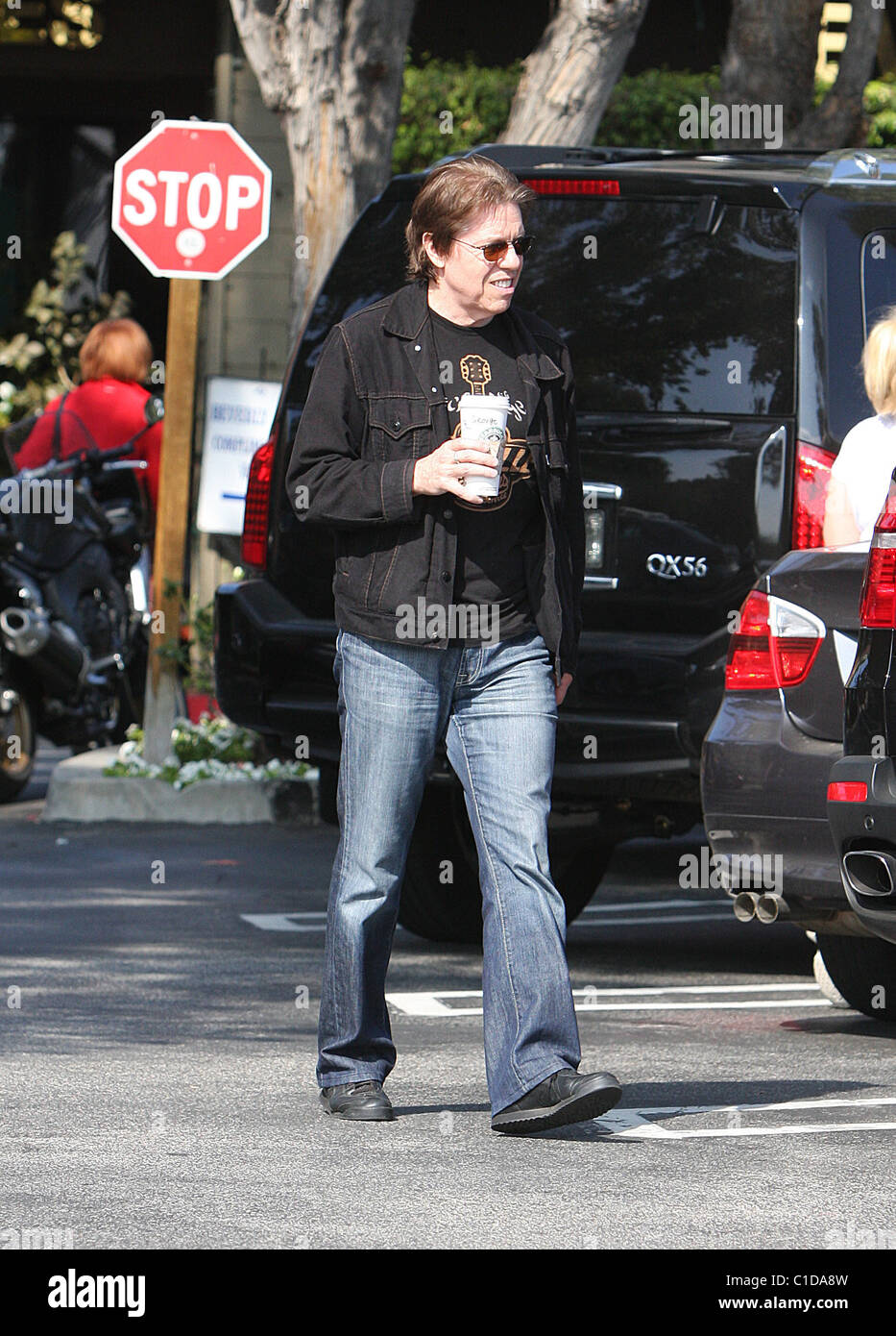Rock 'n roller George Thorogood, 56, leaves a coffee shop holding hands ...