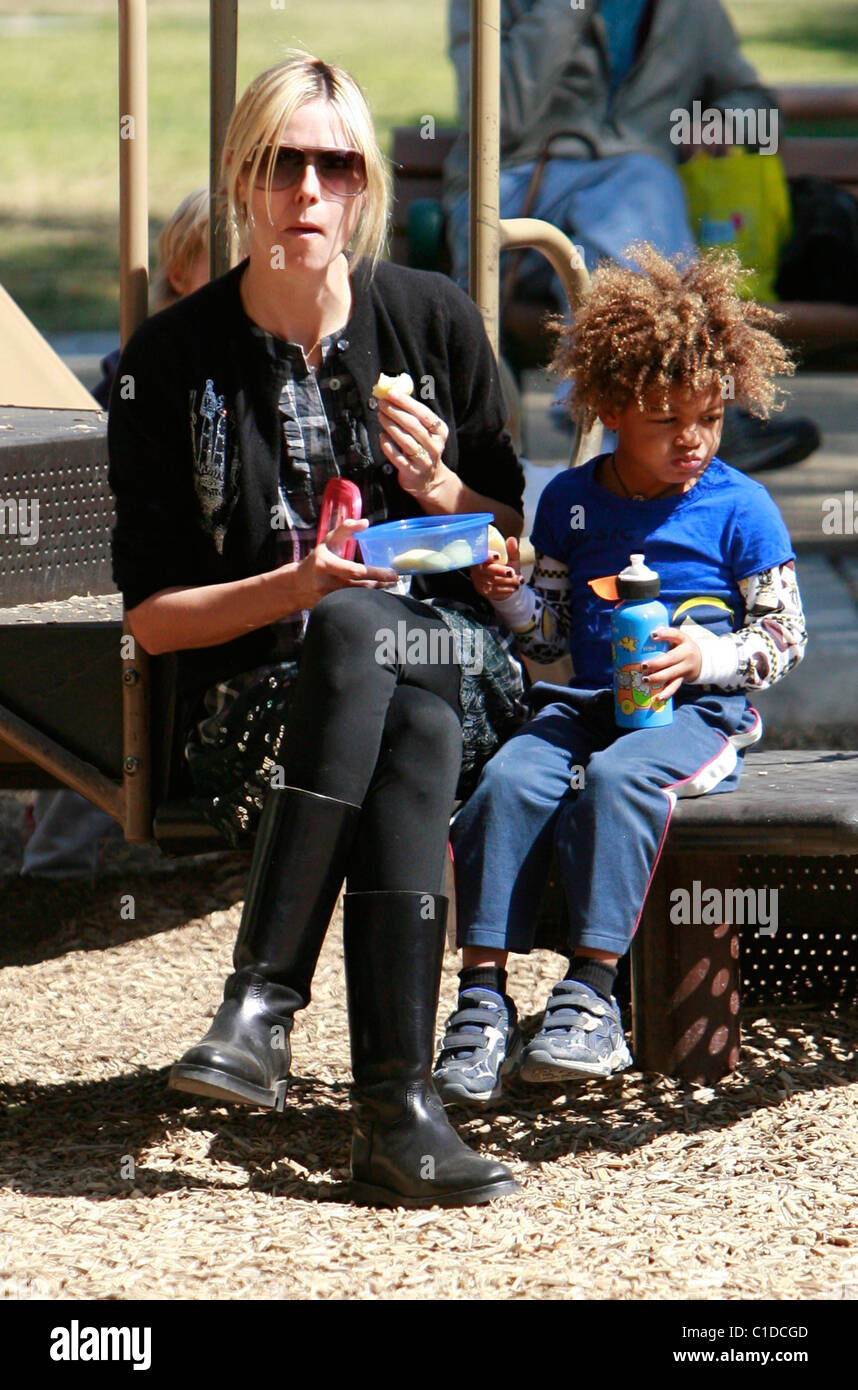 Heidi Klum and her son Henry eat fruit together while sitting in the ...