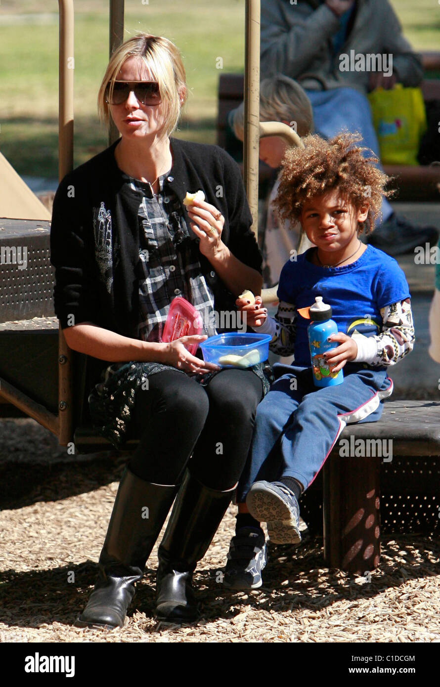 Heidi Klum and her son Henry eat fruit together while sitting in the ...