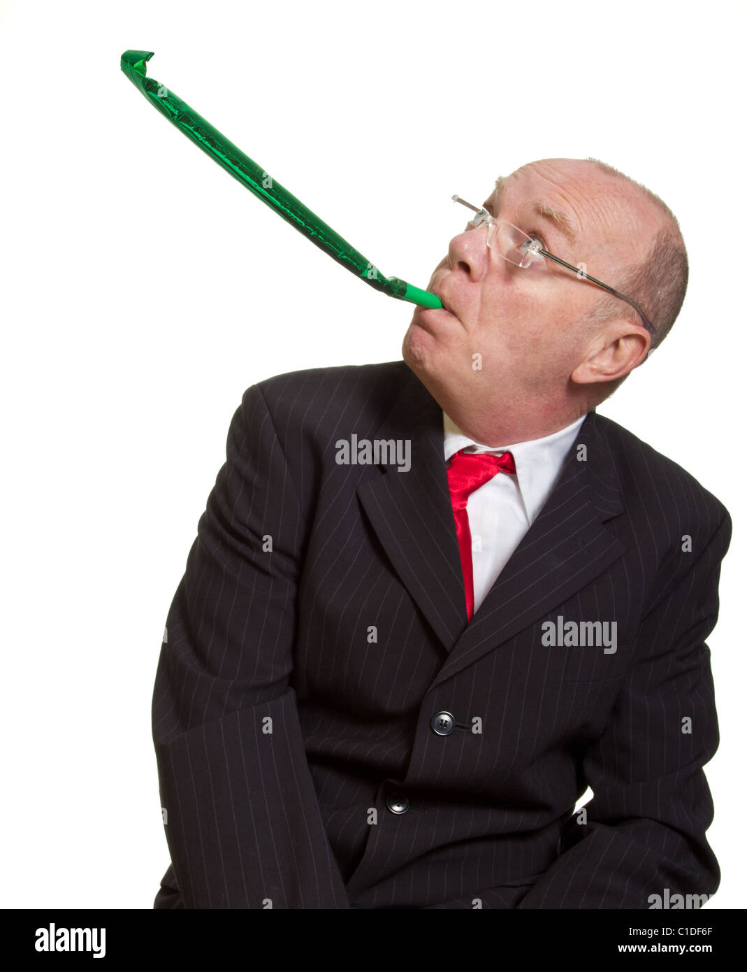 Expressive senior businessman isolated on white party pooper concept ...