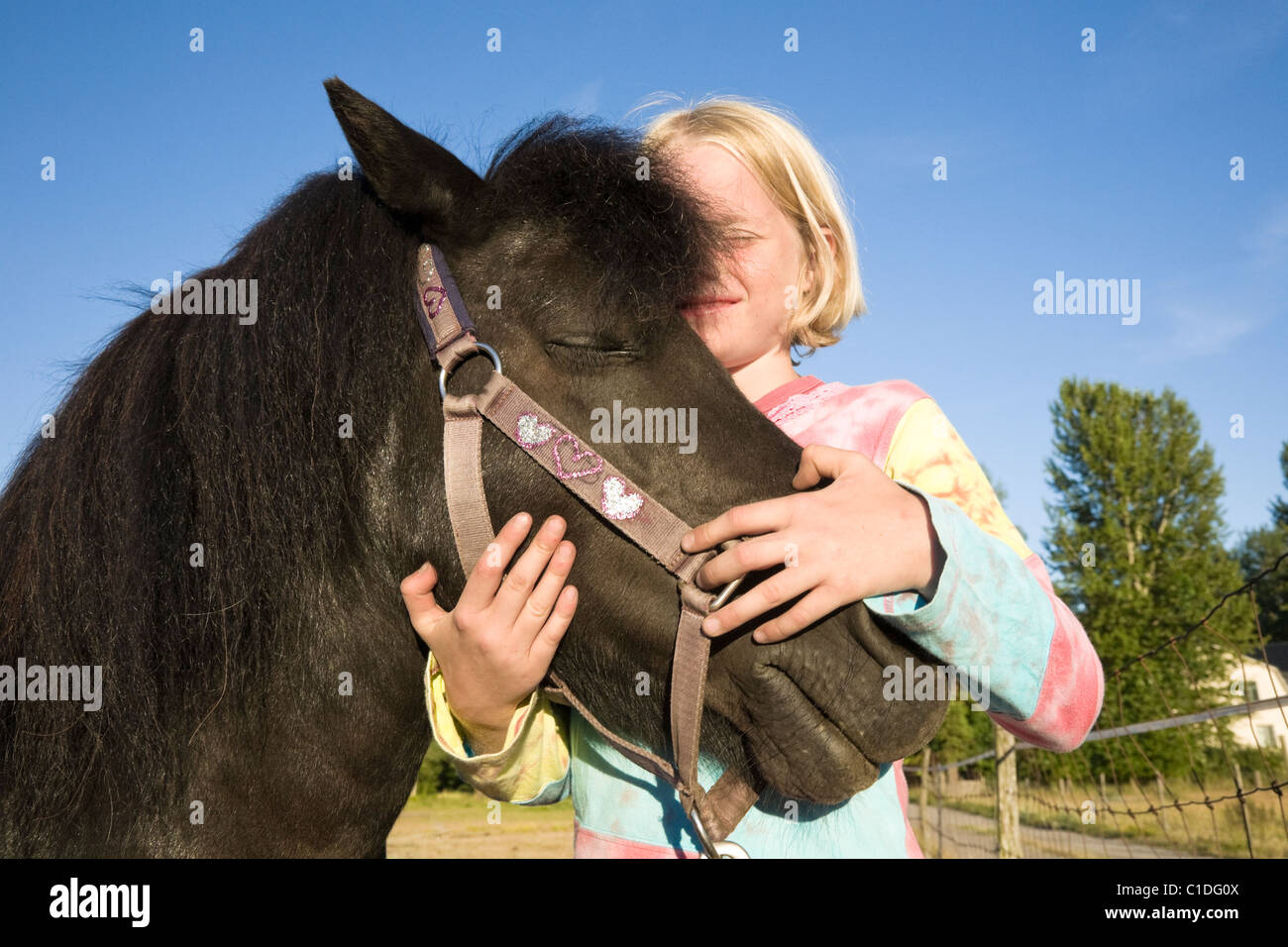 Girl hugging pony hi-res stock photography and images - Alamy