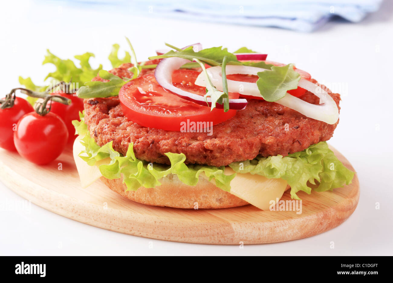 White bun with patty, cheese and vegetable Stock Photo - Alamy