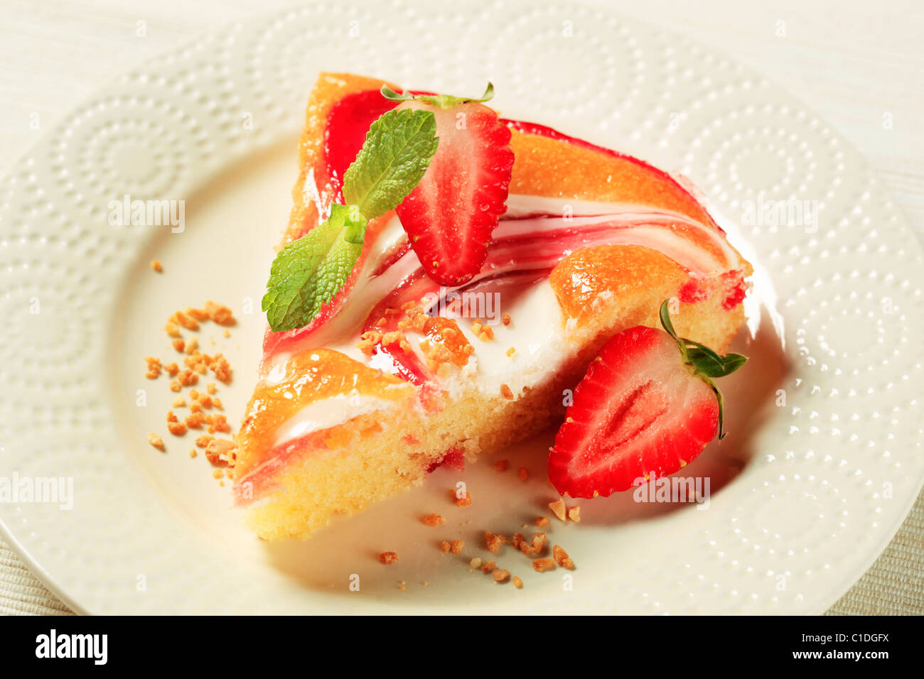 Sponge cake with curd and sweet fruit coulis Stock Photo - Alamy