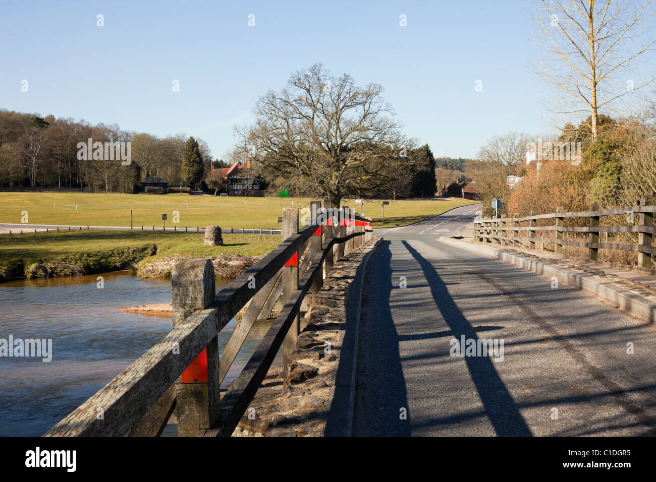 Tilford, Surrey, England, UK. View to village green along the narrow ...