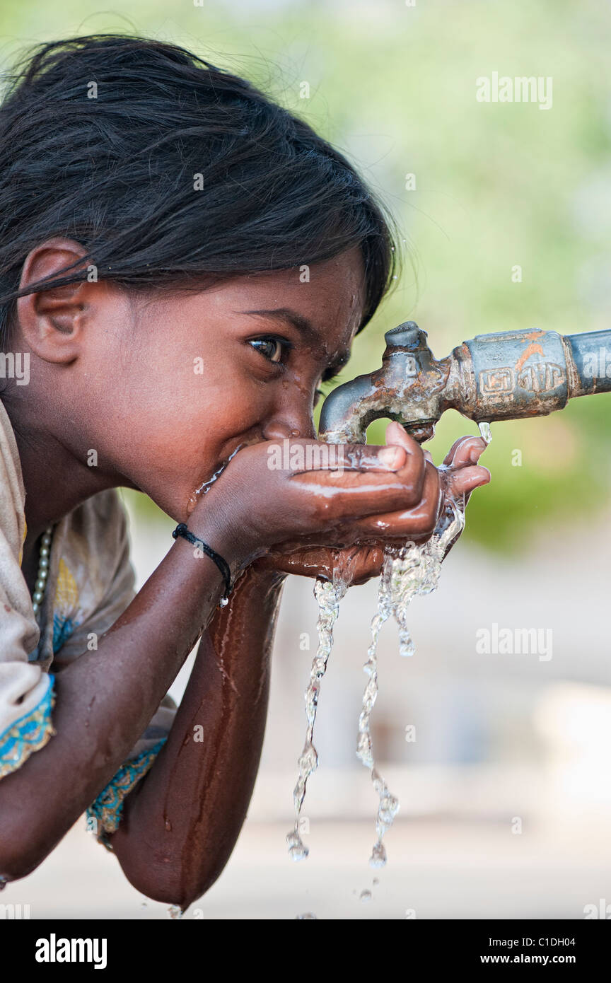 Ethnic child drinking water from tap hi-res stock photography and ...