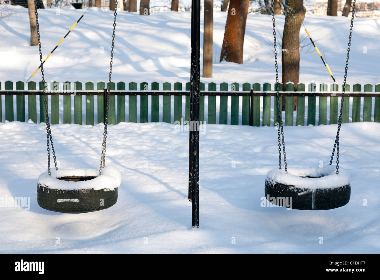 Empty swings snow hi-res stock photography and images - Alamy