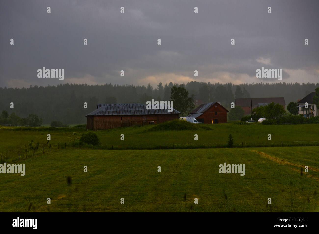 Farm in rainy weather Stock Photo - Alamy
