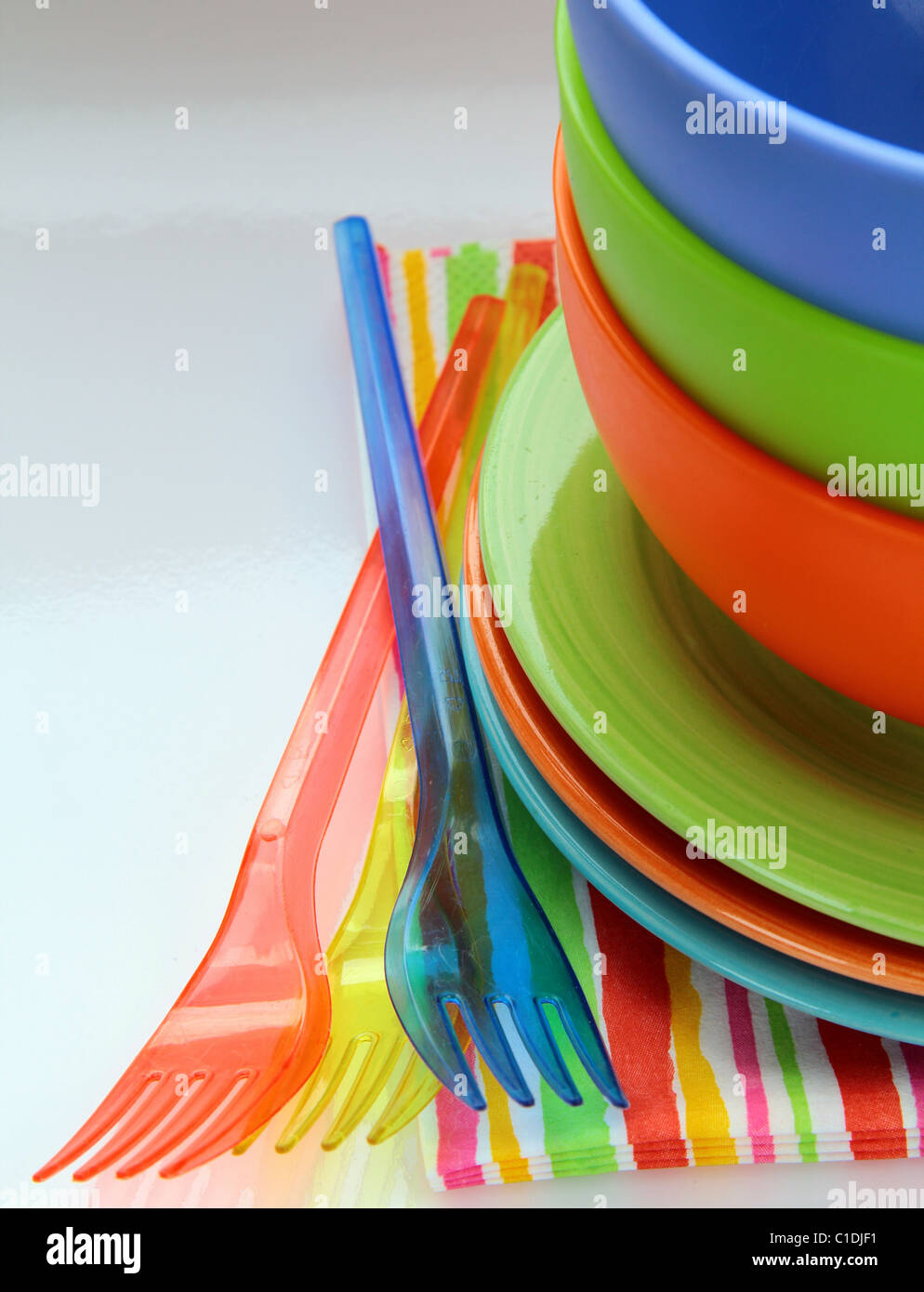colorful plastic tableware and napkins for picnics Stock Photo - Alamy