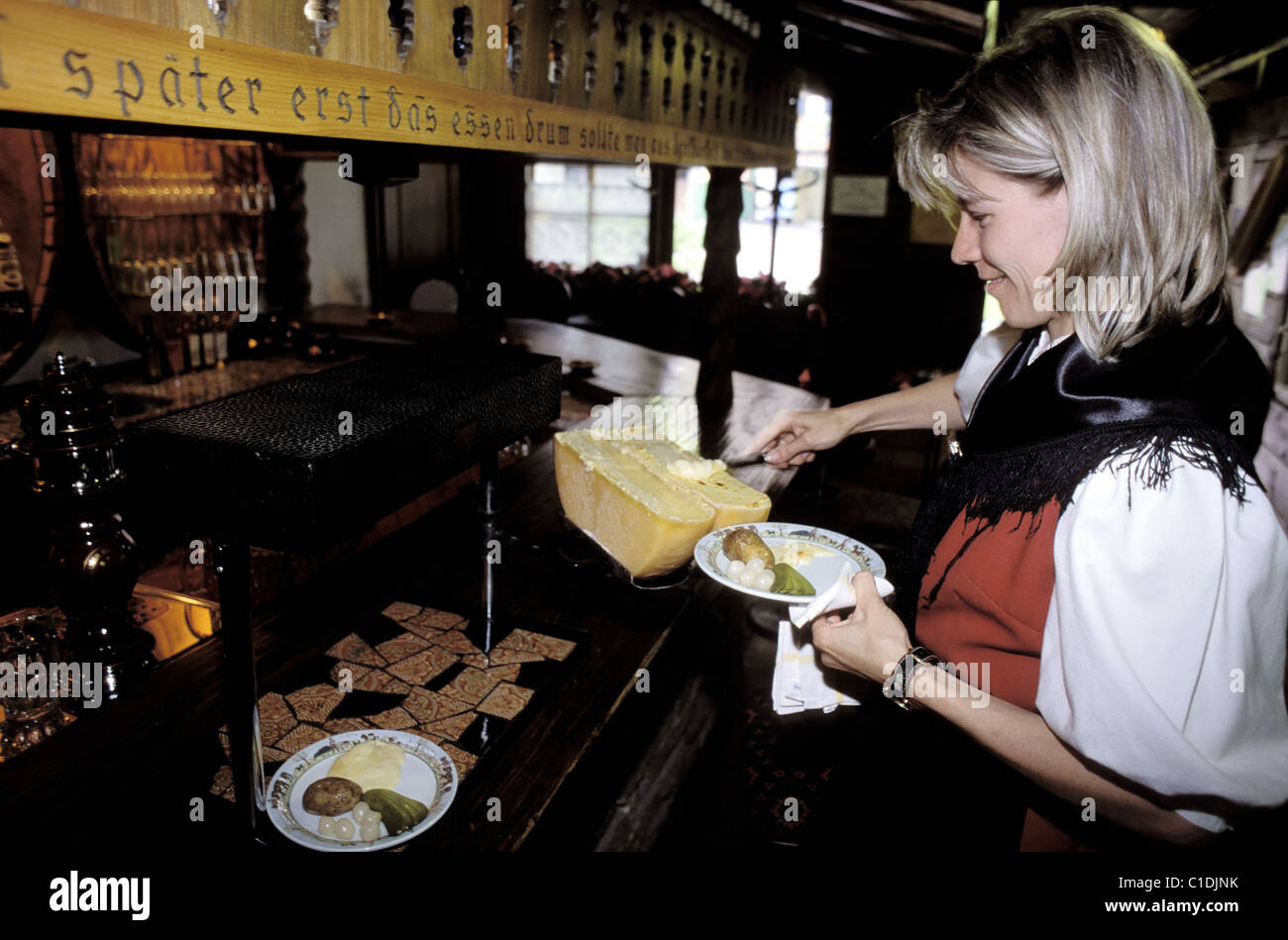 Switzerland, Valais Region, Zermatt, raclette (cheese speciality) at ...