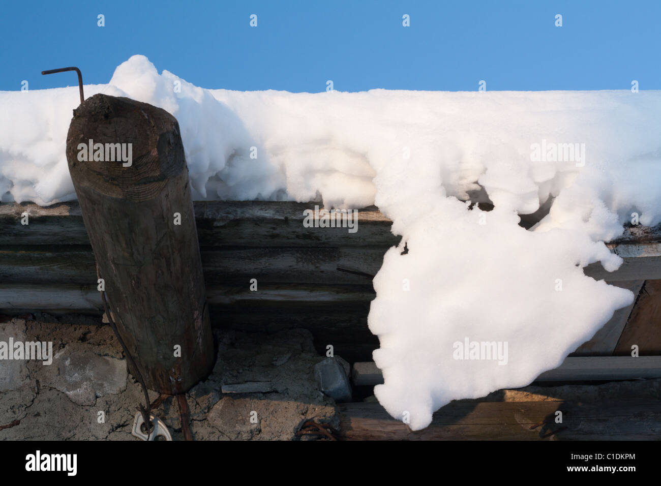 Wooden roof, drooping snow, winter, sunny, blue sky Stock Photo - Alamy