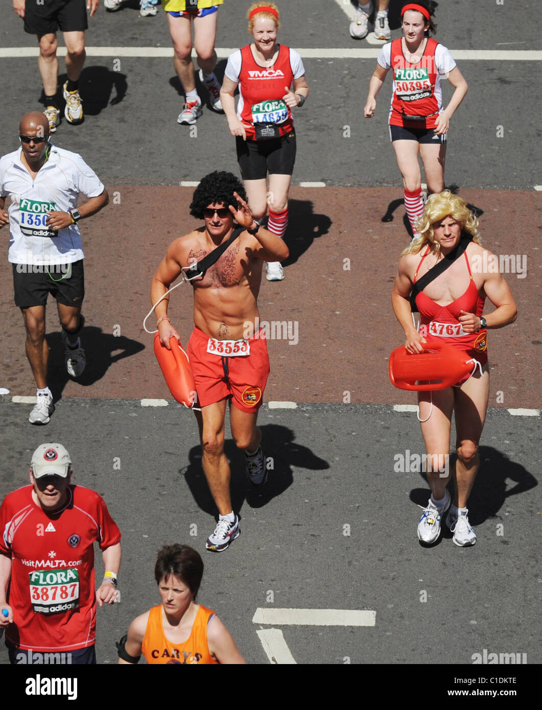 Baywatch run along the embankment during London Marathon,London,England ...