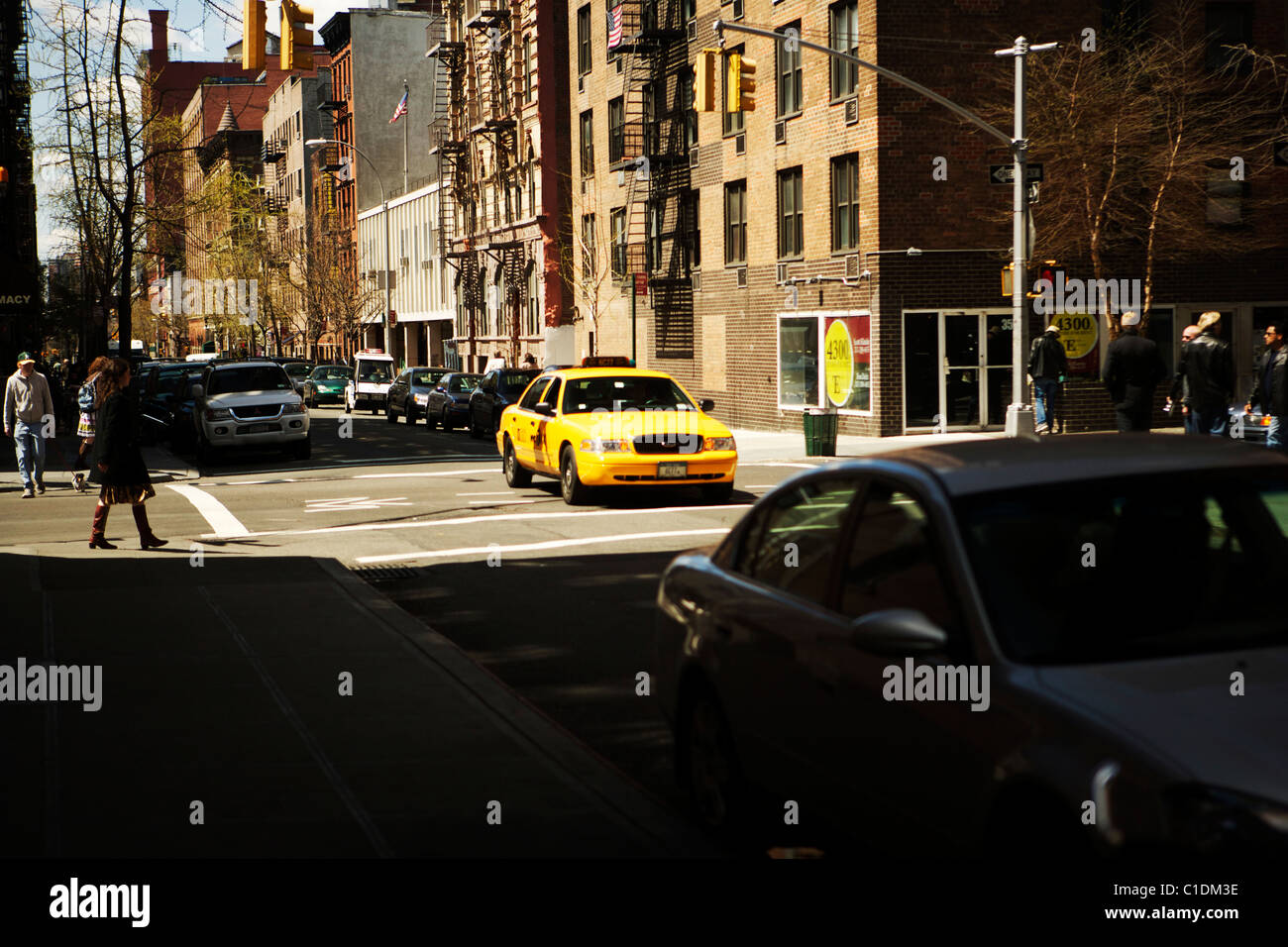 A New York Yellow Cab drives in Manhattan, New York city USA Stock ...
