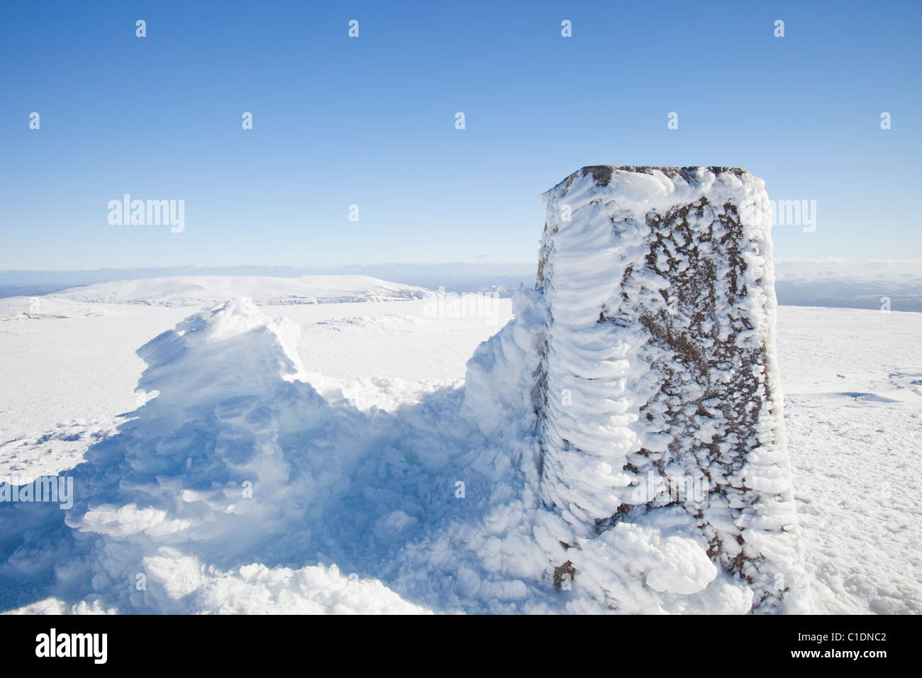 The trig point covered in hoare frost on the summit of Ben Macdui ...