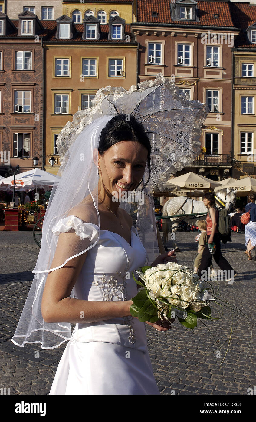 Poland, Warsaw, just married women on the market place of the old town ...