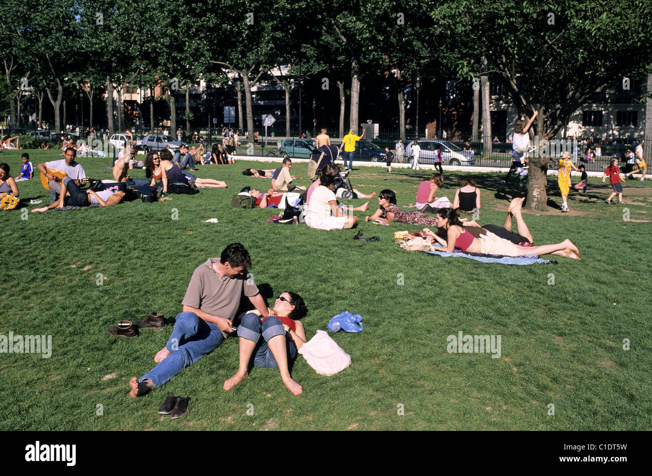 France, Paris, sunbath at Villemin public garden along Saint Martin ...
