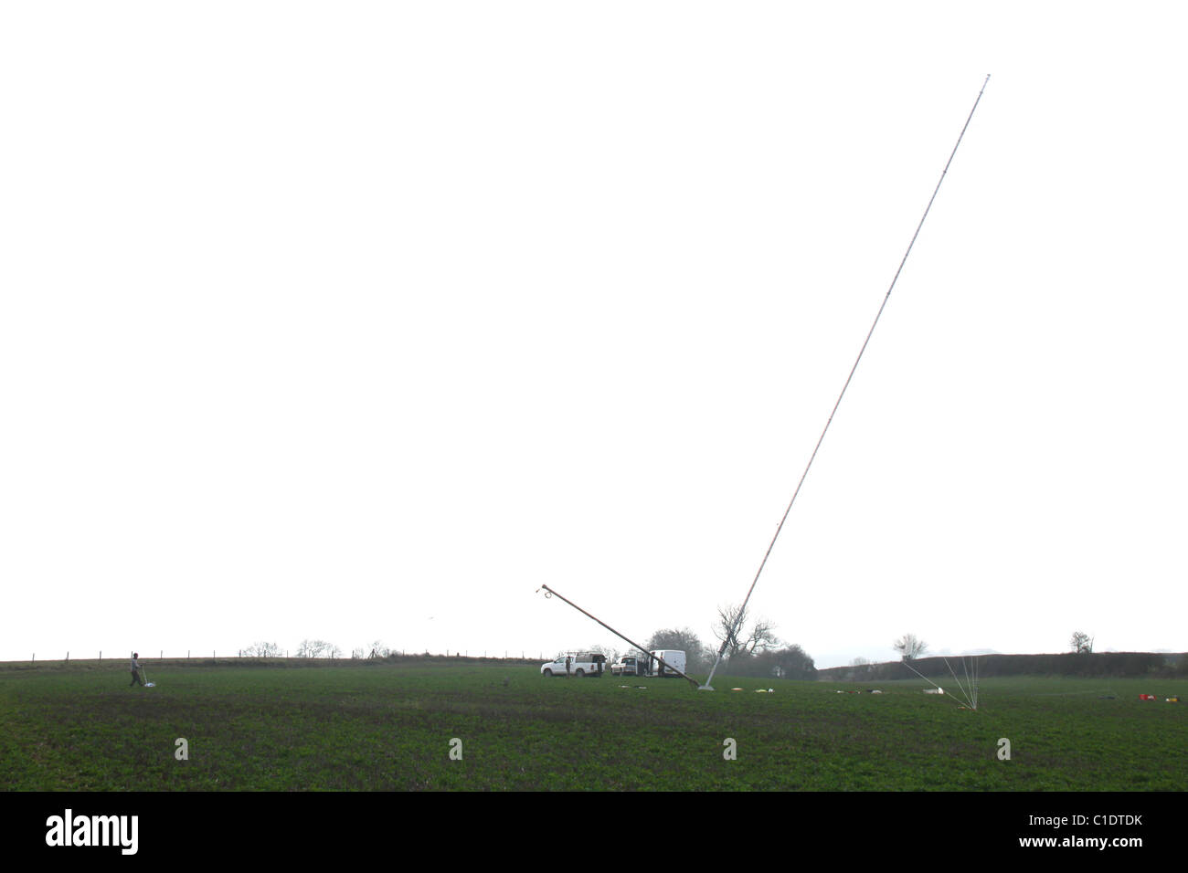 Wind-monitoring meteorological mast (met mast) with data logger being ...