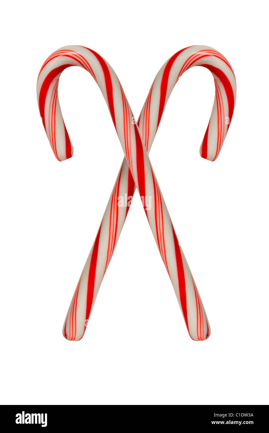 Two crossed candy canes on white background Stock Photo - Alamy