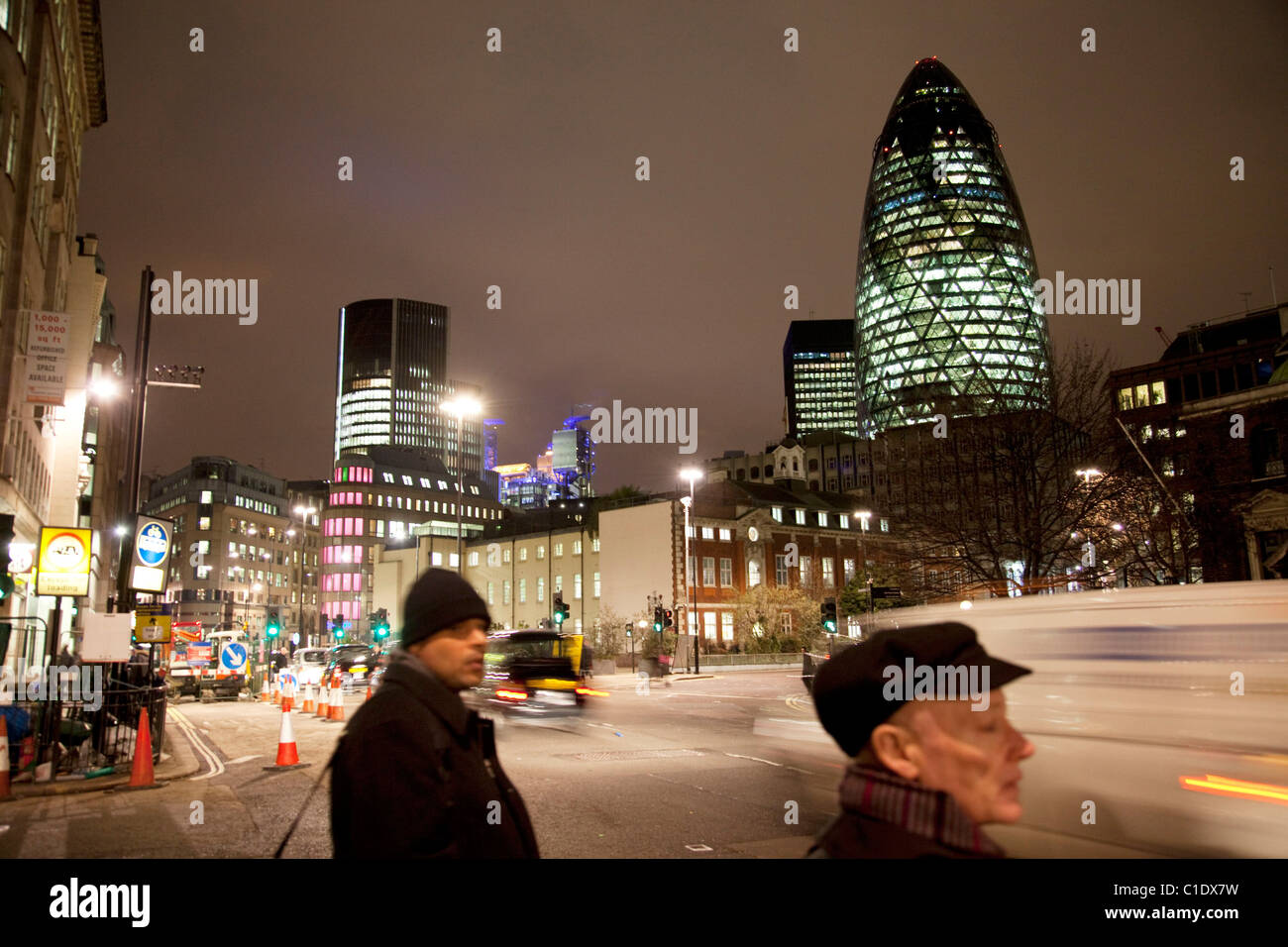 Night time in the City of London. The iconic building at 1 St Mary Axe ...