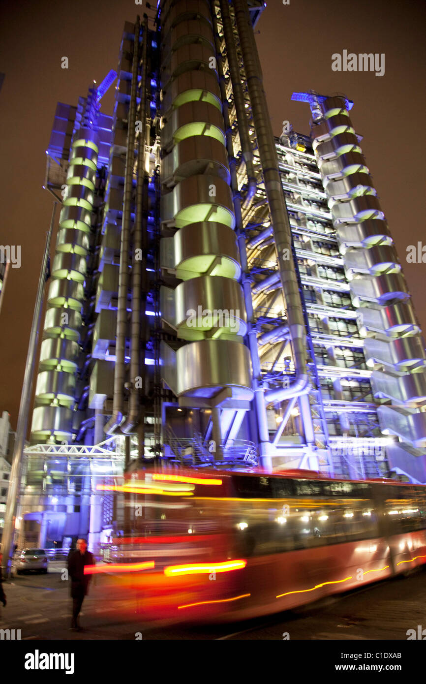 Night time scene in the City of London. The Lloyds building lit up with ...