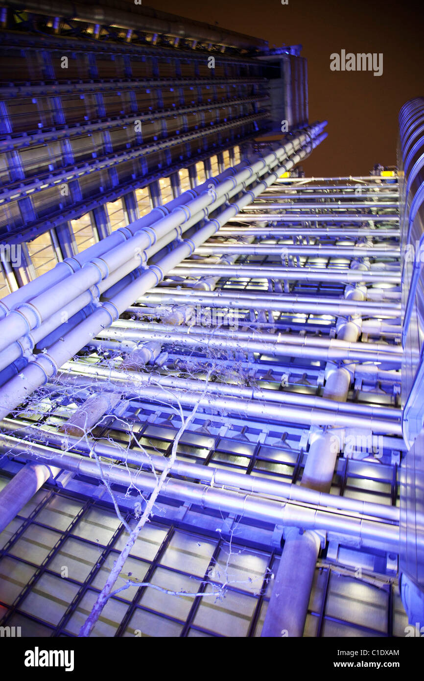Night time scene in the City of London. The Lloyds building lit up with ...
