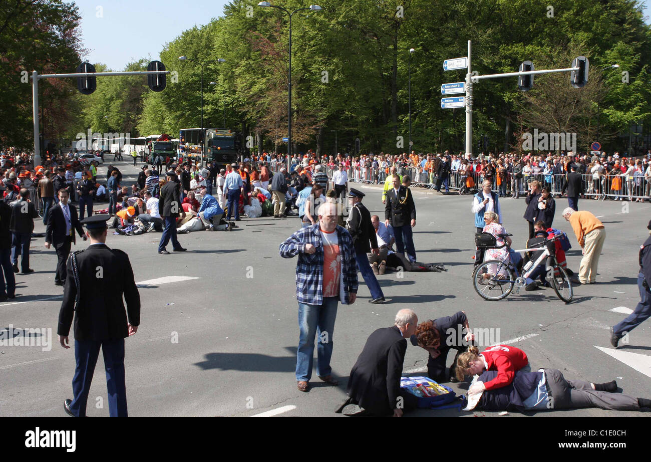 Police attend to victims after a speeding car crashed into a crowd at a ...