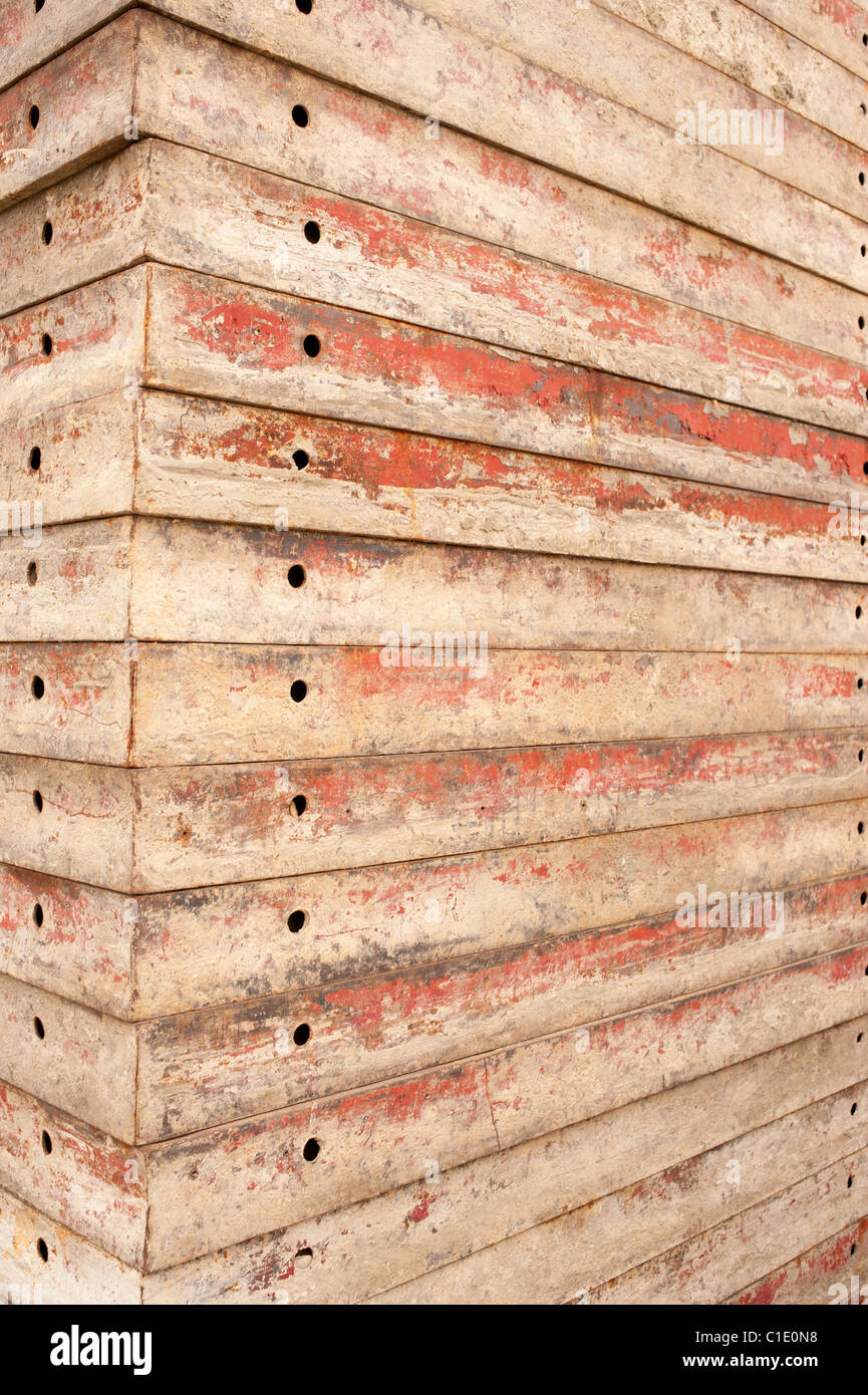 Concrete form boards piled up, a building material background Stock ...