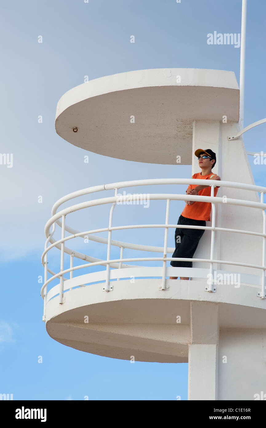 Lifeguard on duty on top of a watch-tower Stock Photo - Alamy