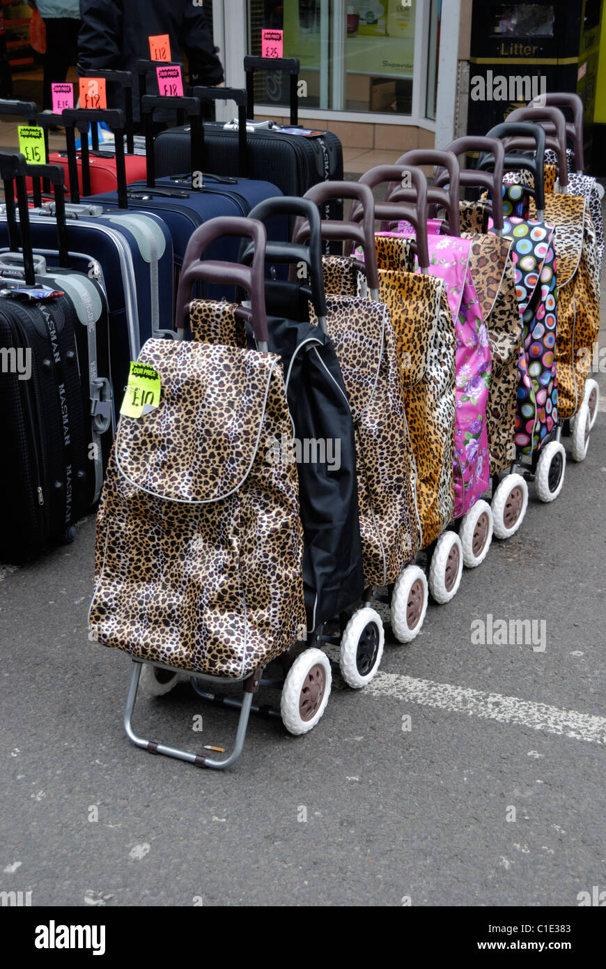 Colourful shopping trolleys on display in a market Stock Photo - Alamy