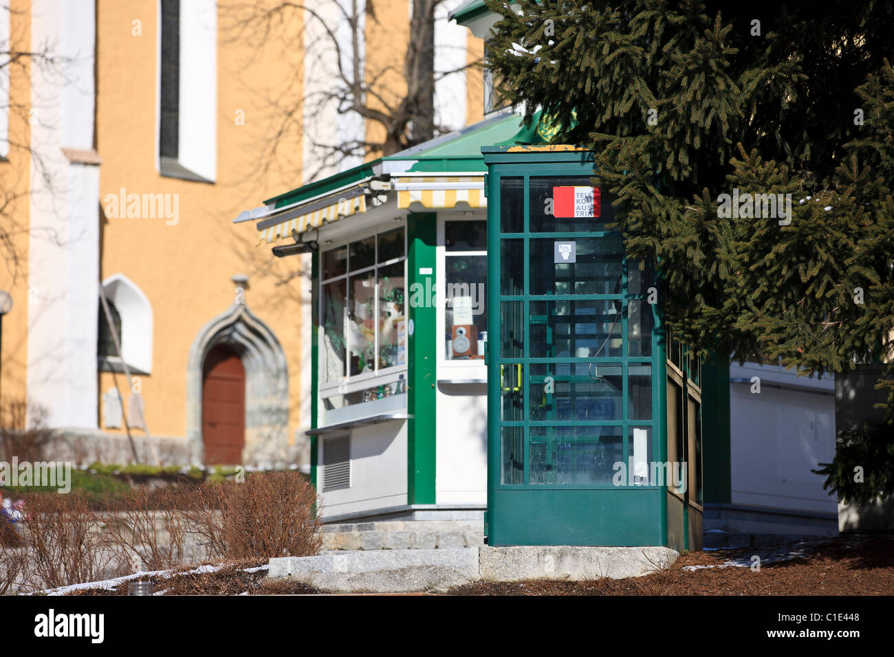 Telekom Austria phone booth in front of a kiosk and church Stock Photo ...